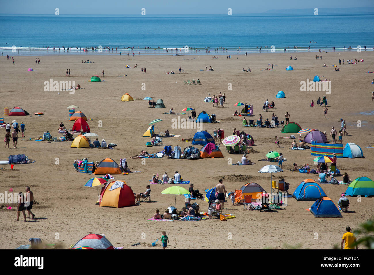 People enjoying a summers day on Woolacombe Beach, North Devon, England ...