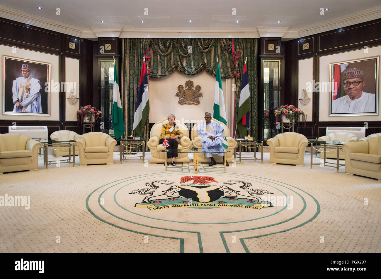 Prime Minister Theresa May meets Nigerian President Muhammadu Buhari at the presidential villa ...