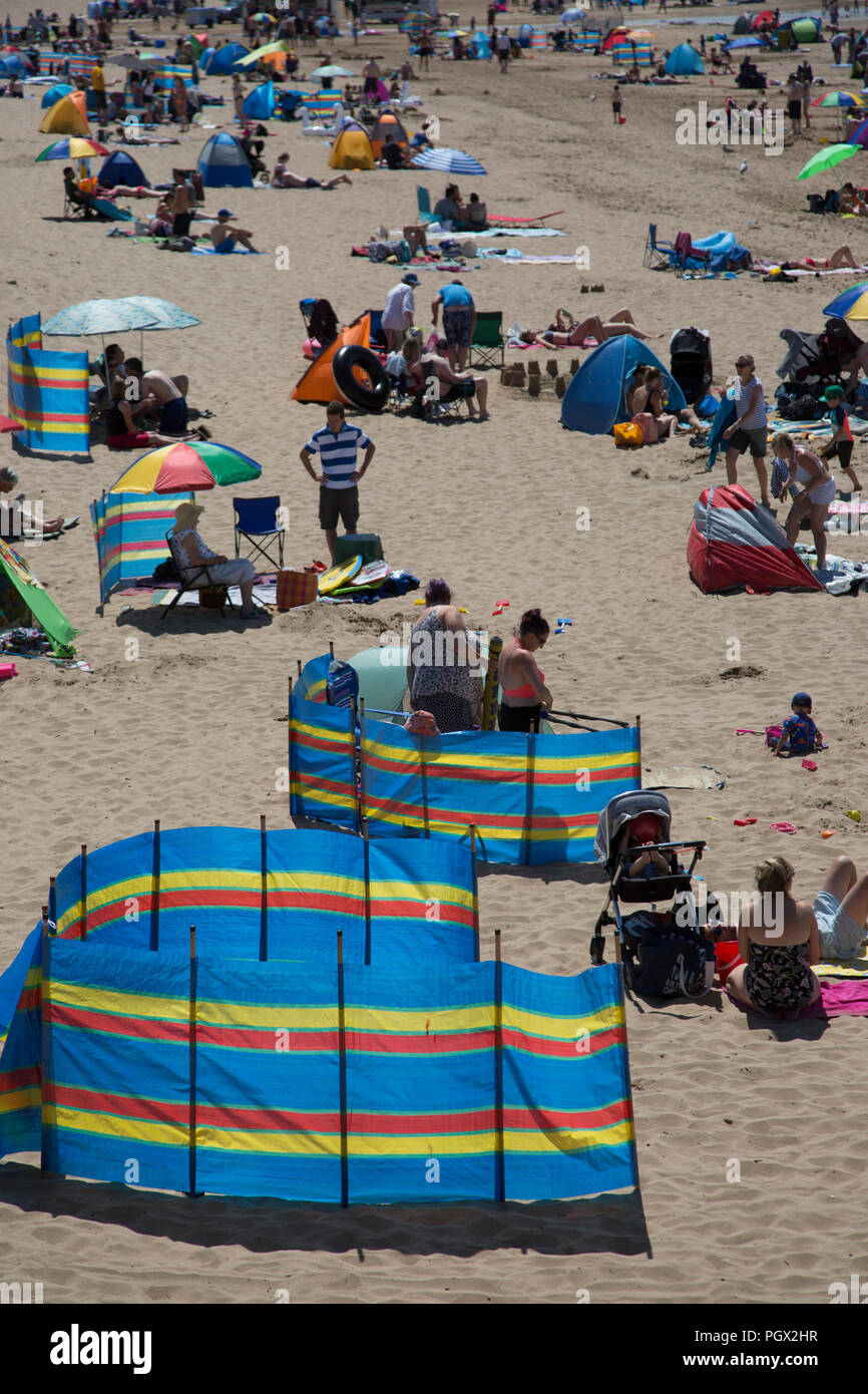 People enjoying Woolacombe Beach in North Devon in the summer sun in ...