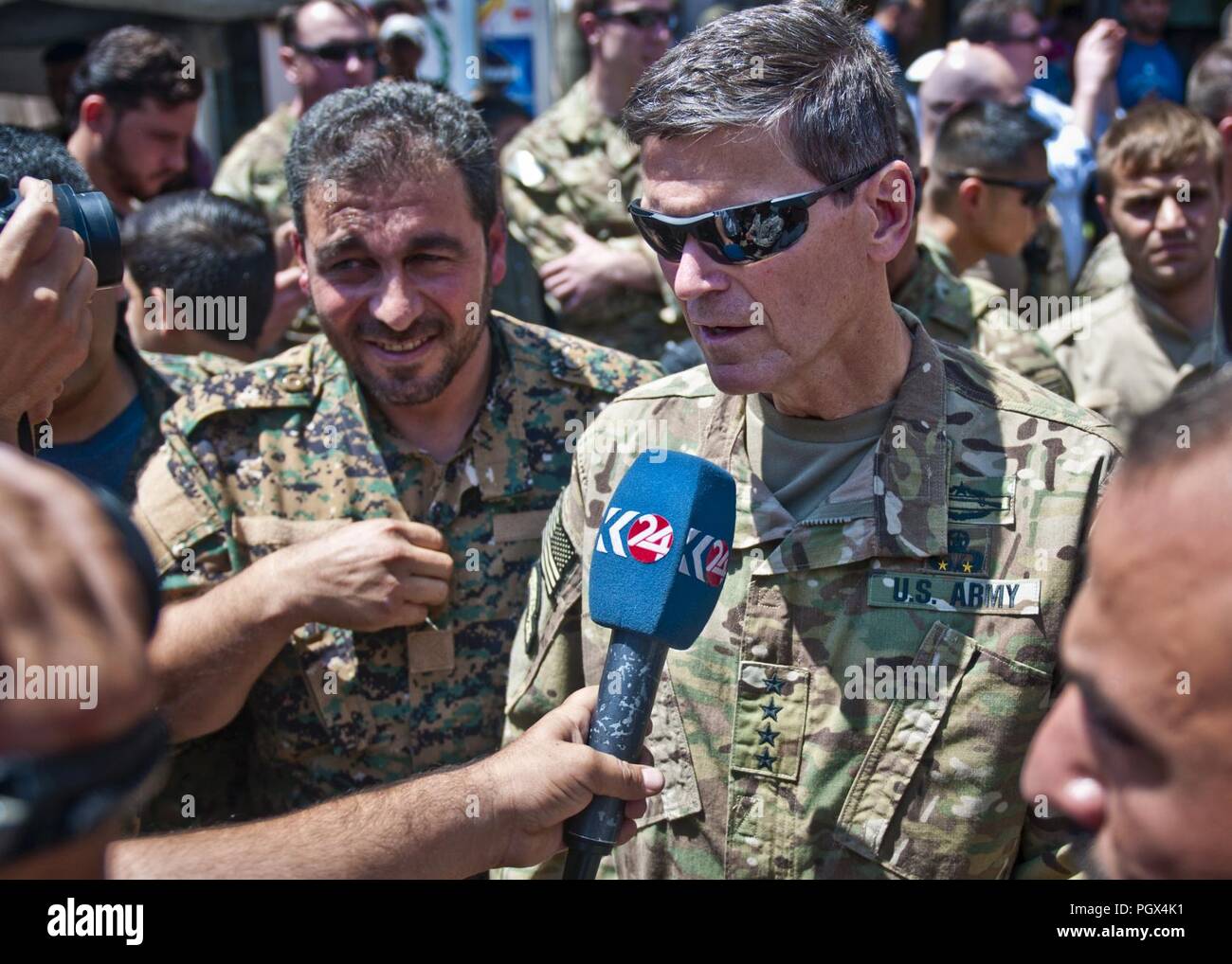U.S. Army Gen. Joseph Votel, Central Command commander, speaks with the ...
