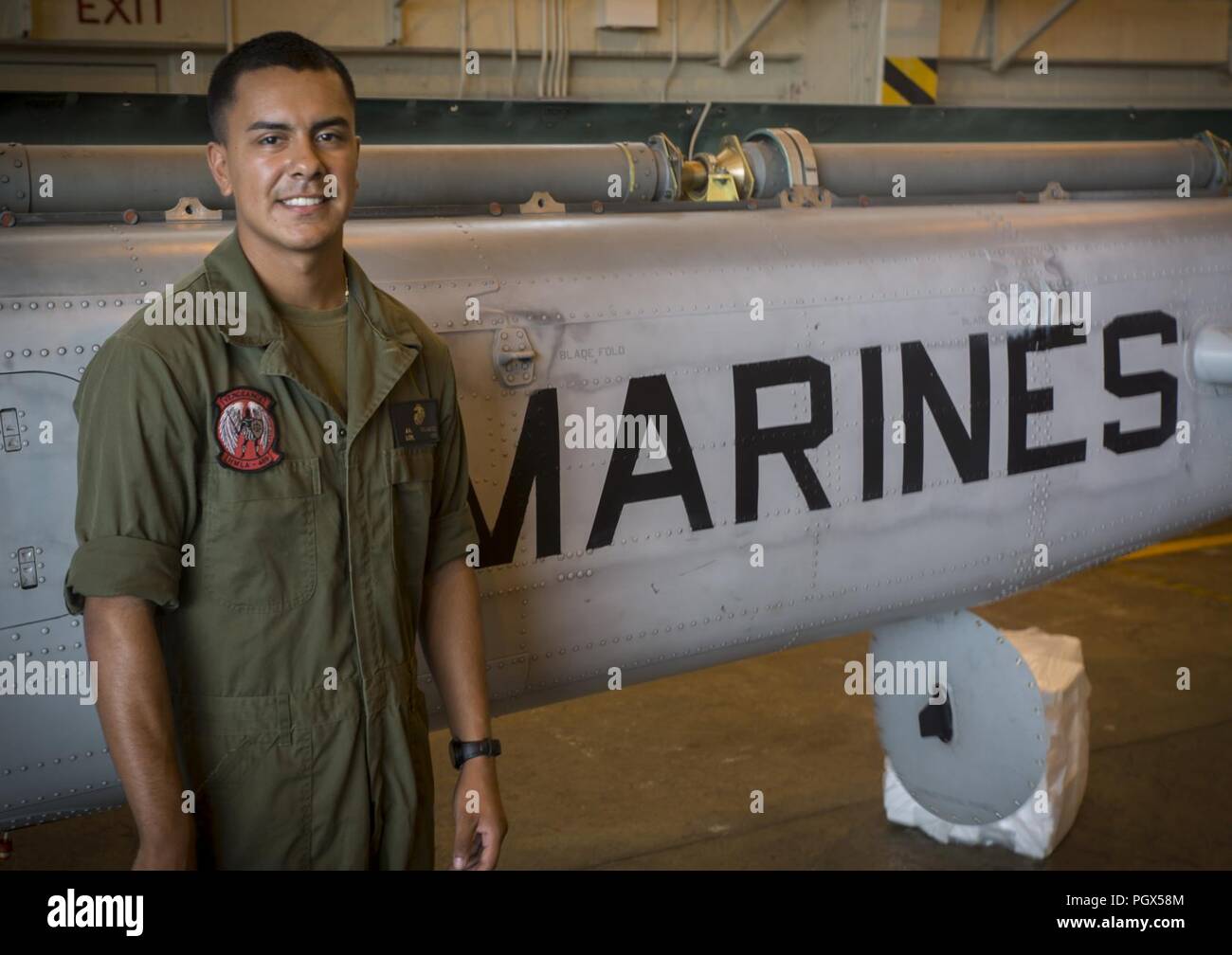 Lance Cpl. Jose Villalobos performs preflight checks on an AH-1Z Viper ...