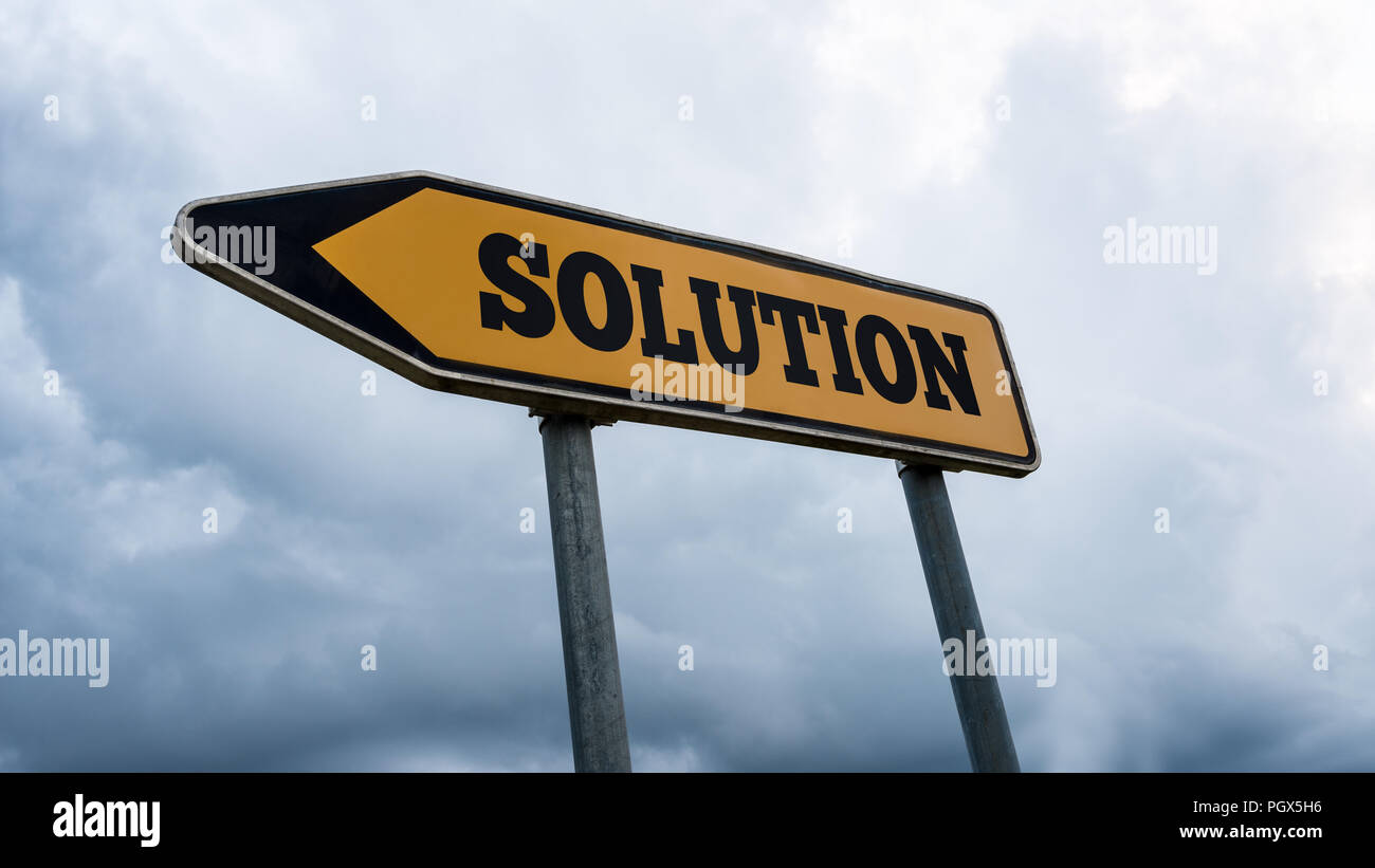 Word Solution written on yellow street sign with left pointing arrow ...