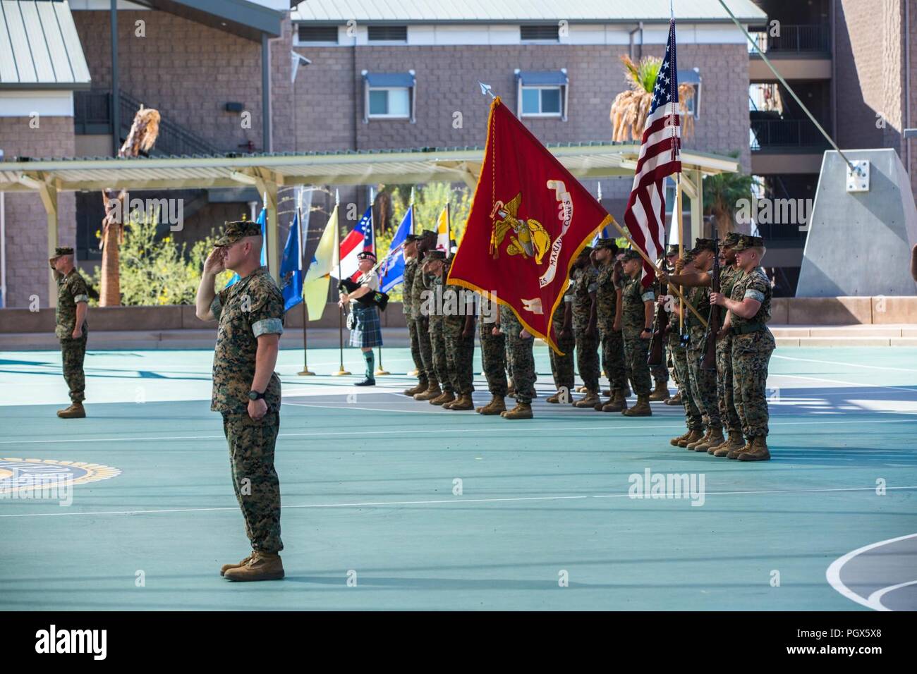 Marines with Marine Corps Logistics Operations Group render a salute to ...