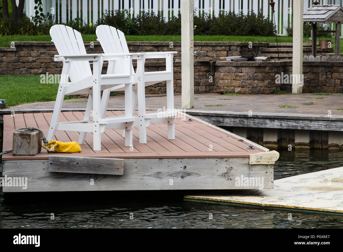 Docks, Rocks and Chairs Next to a Lake in Summer at Sunset Stock Photo ...