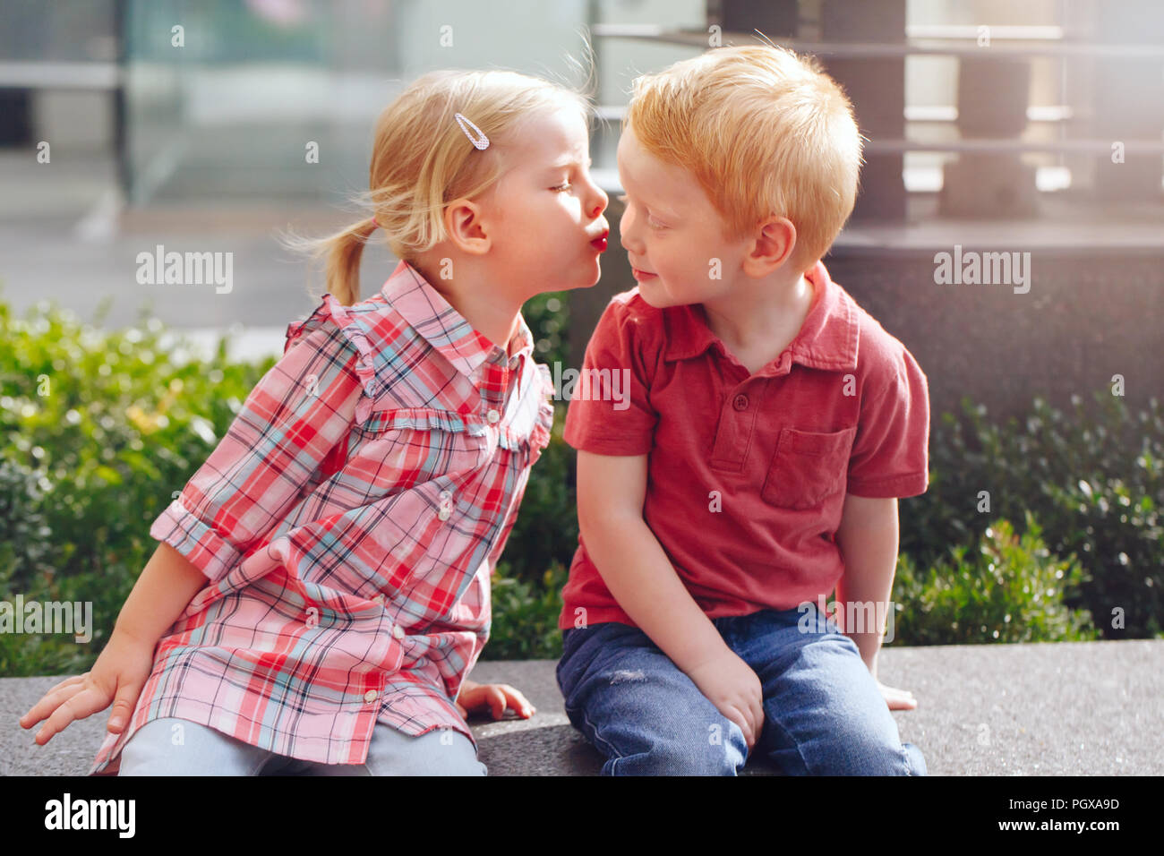 Two small children kissing hi-res stock photography and images - Alamy