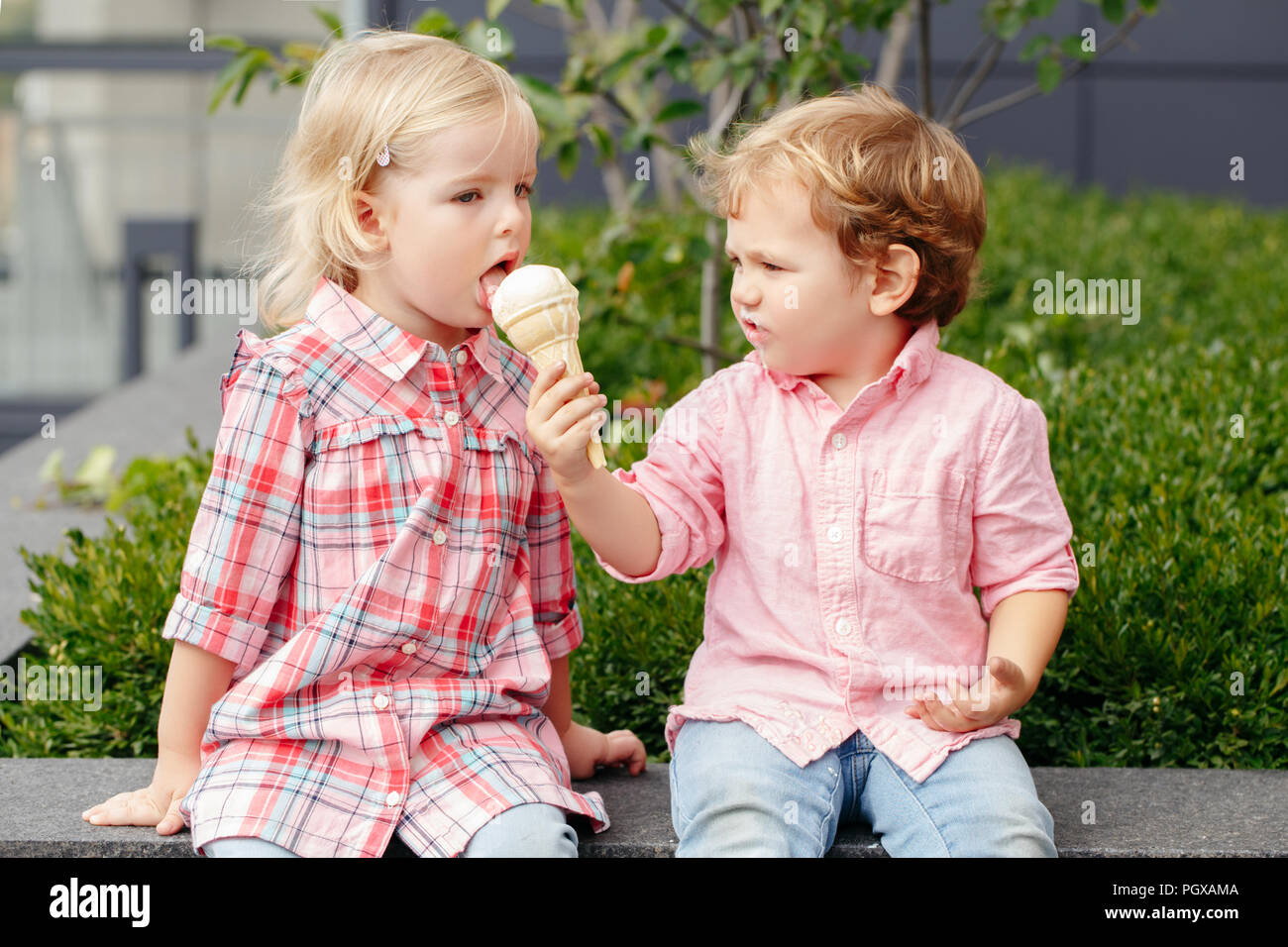 Kids Sharing Ice Cream