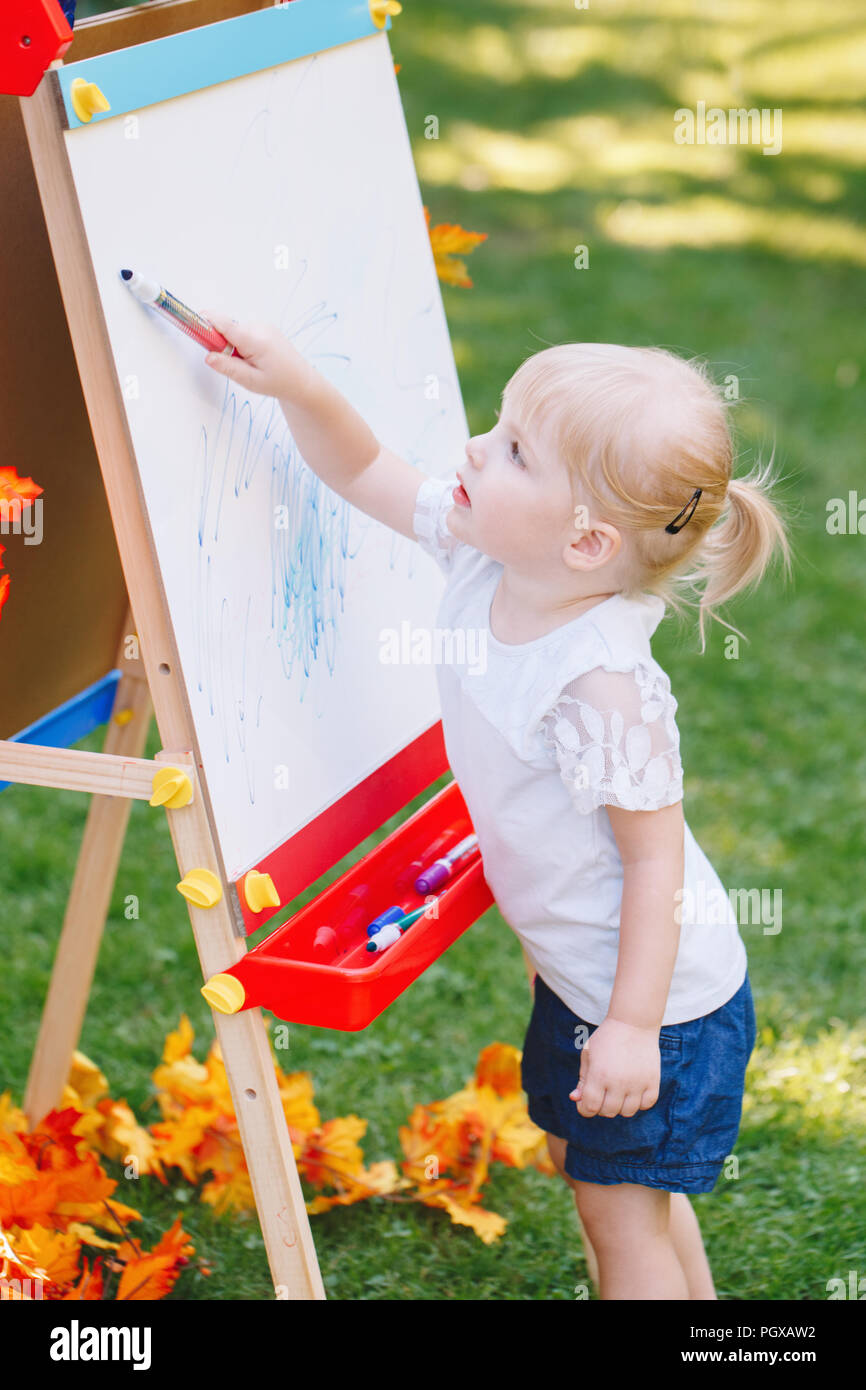 White Caucasian toddler child kid girl standing outside in summer ...