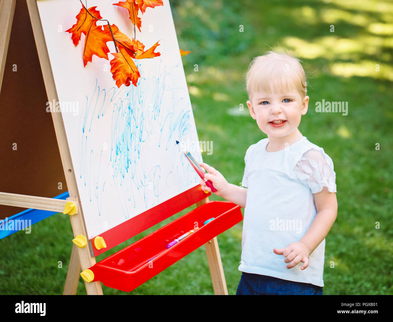White Caucasian toddler child kid girl standing outside in summer ...