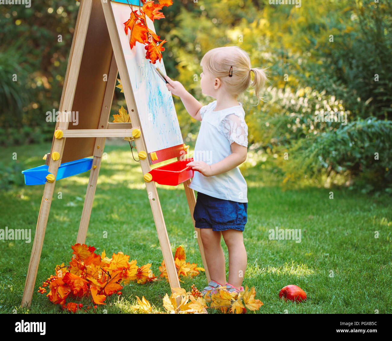 White Caucasian toddler child kid girl standing outside in summer ...