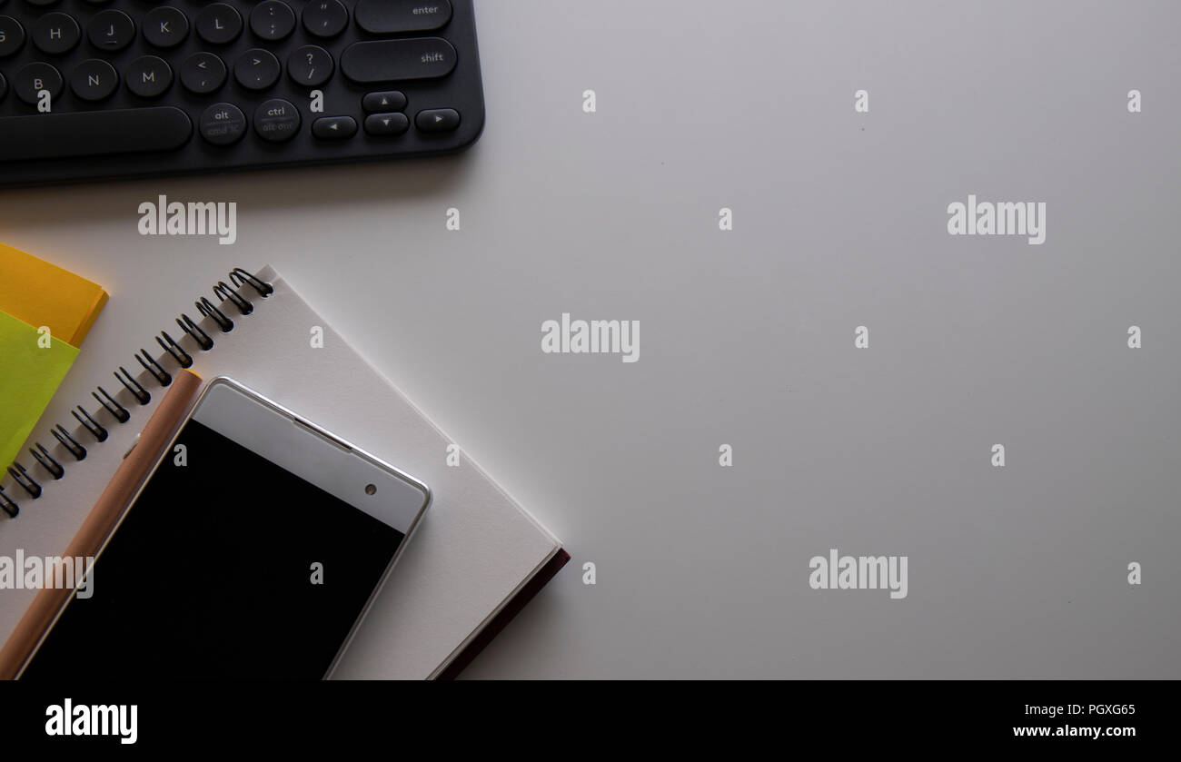 workplace with laptop computer and office supply on the white table in ...