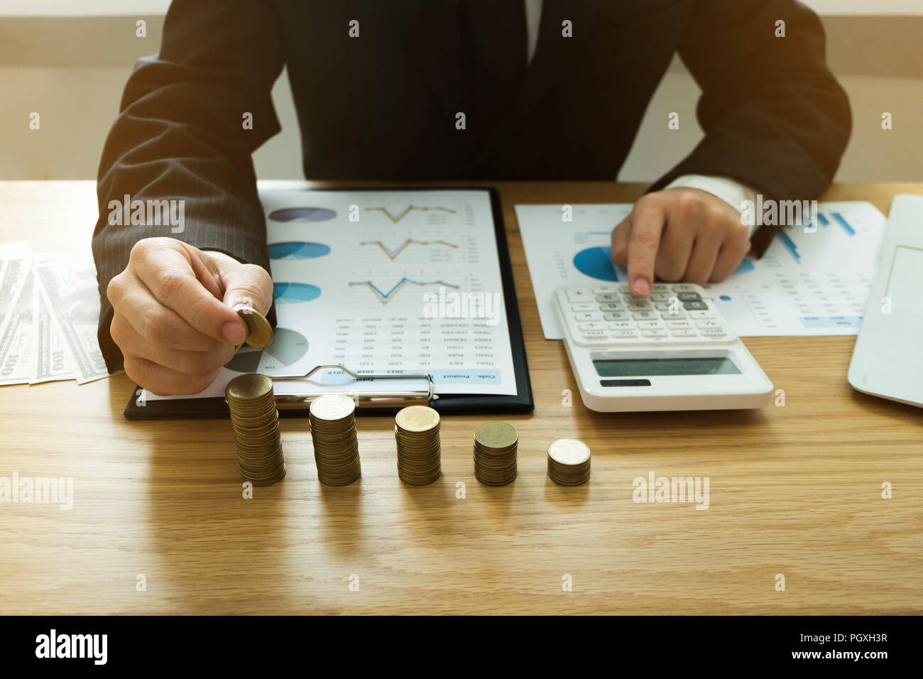 Business person counting money table hi-res stock photography and ...