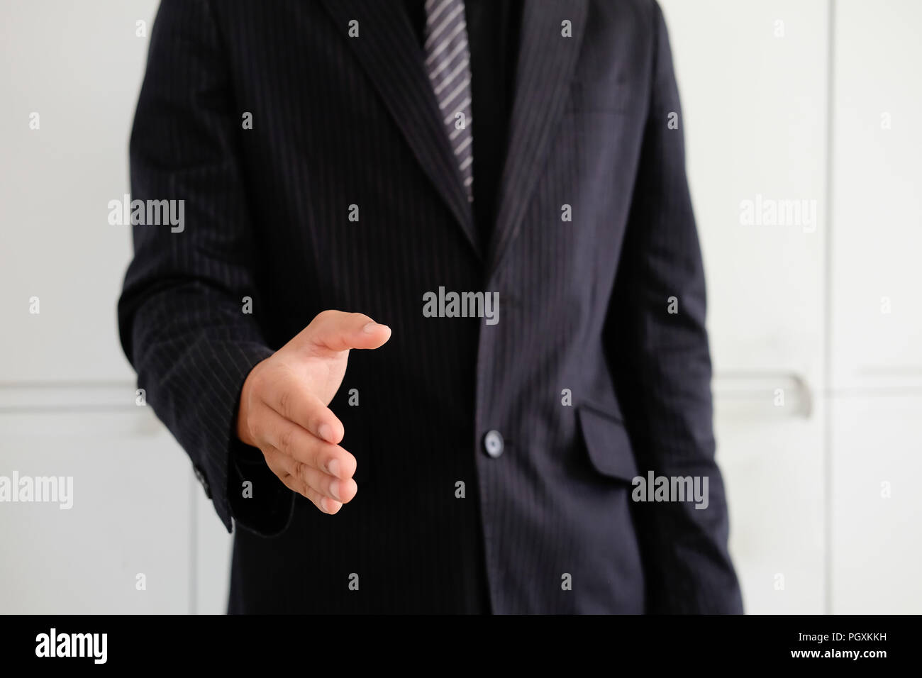 Businessman open hand ready to seal a deal, partner shaking hands ...