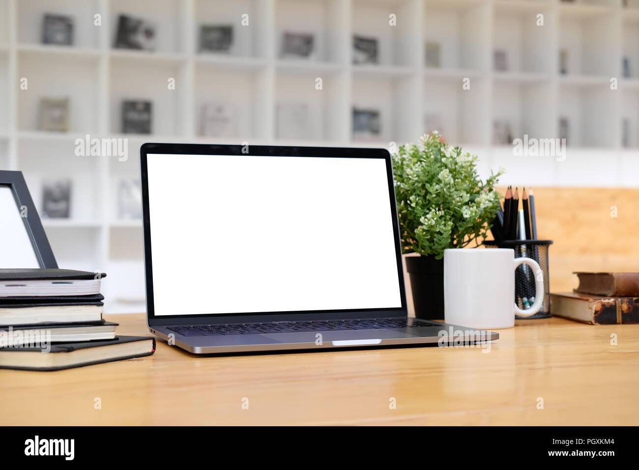 Mockup laptop computer on wooden table with library background Stock ...