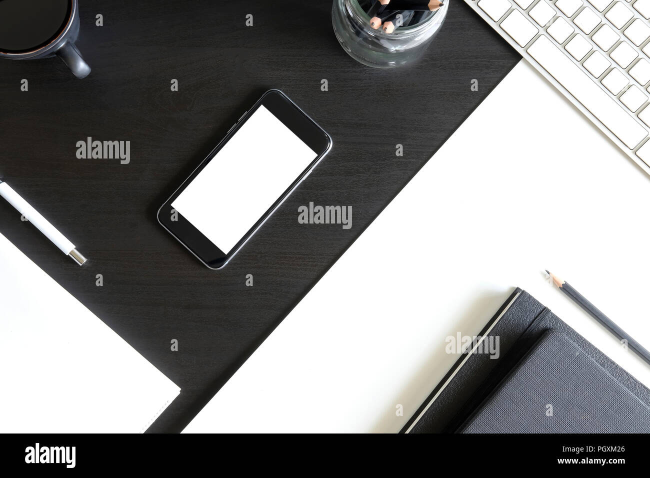 Mockup smartphone on table with coffee and notebook with pen A top view ...