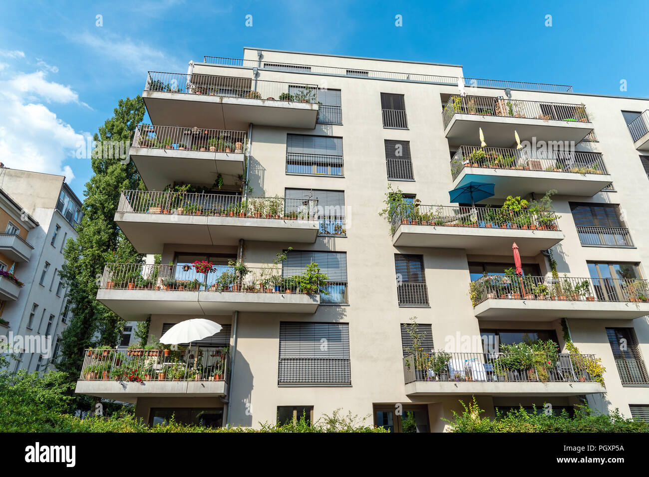 Gray modern multi-family house with balconies seen in Berlin, Germany ...
