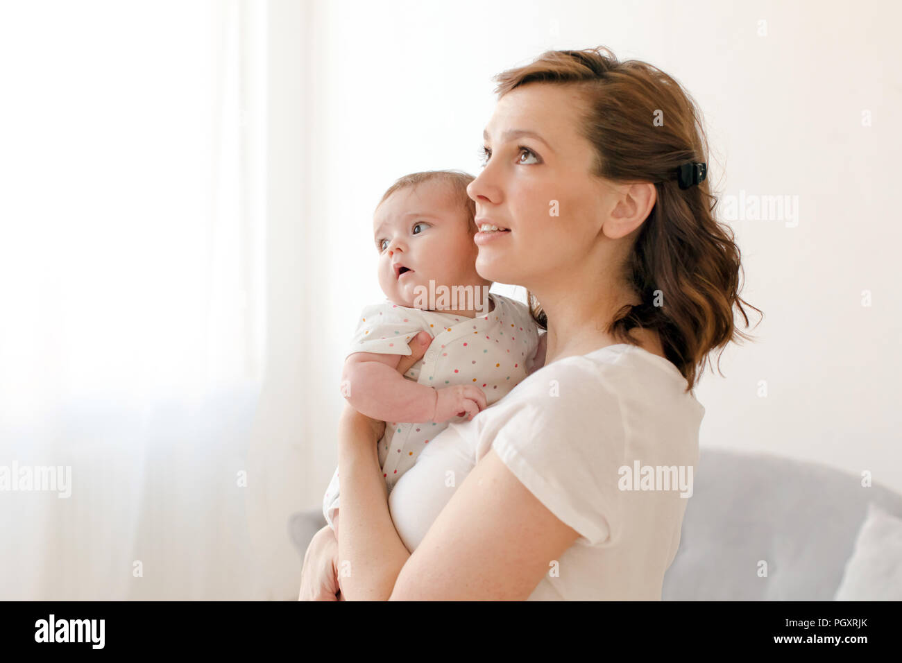 Hands holding baby hi-res stock photography and images - Alamy