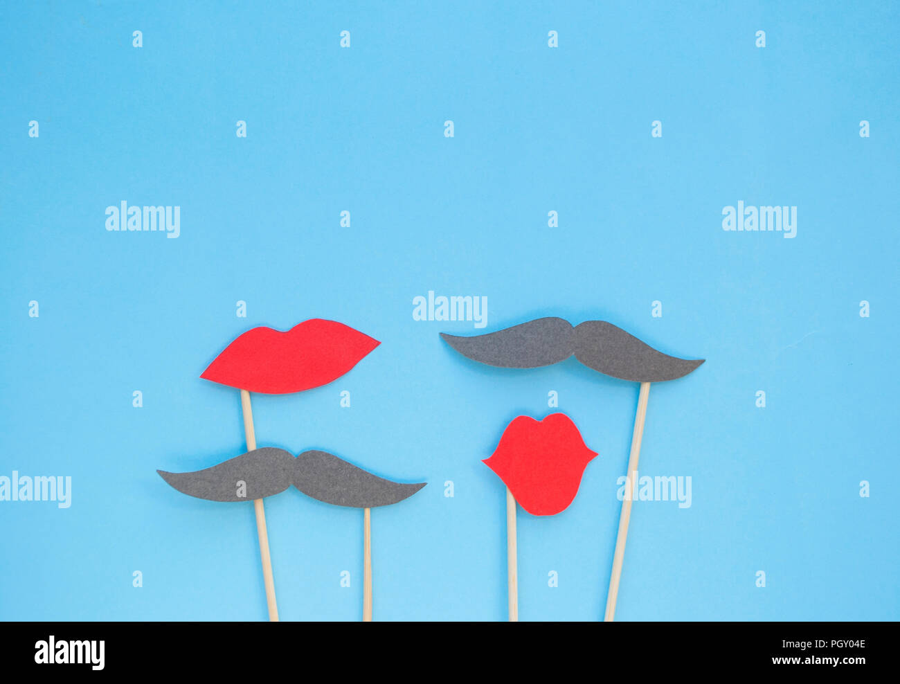 Colorful photo booth props lips and moustaches on blue background with ...