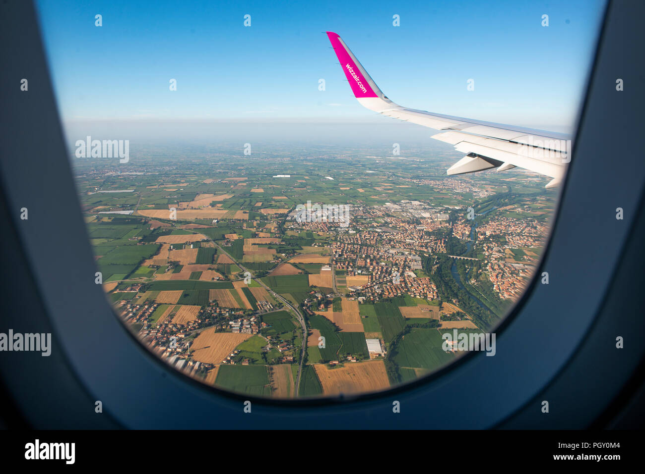 A view of northern Italy, near Milan is seen from an airplane window ...