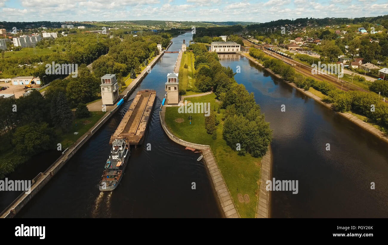 Sluice Gates on the River. Aerial view barge, ship in the river gateway ...