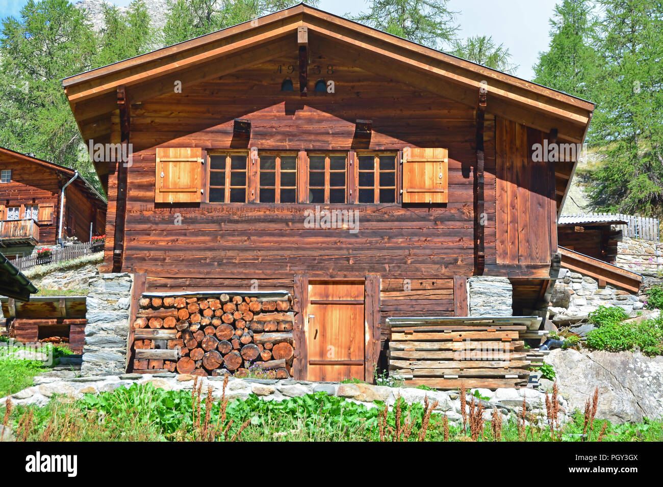 Traditional Swiss Mountain chalet in a mountain summer hamlet with a ...