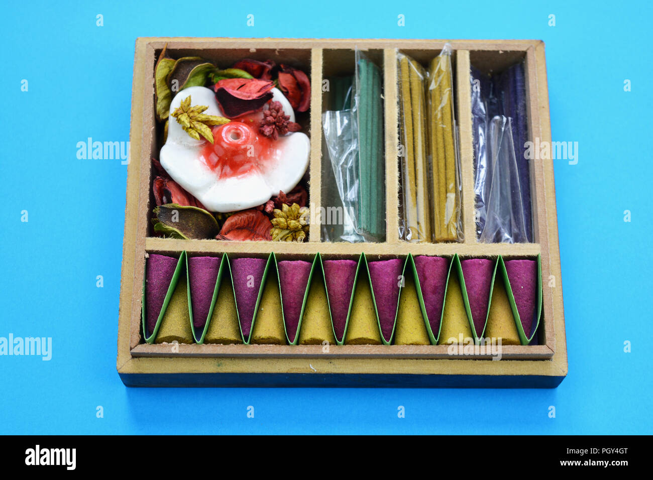 New full indian incense wooden box on blue background Stock Photo - Alamy