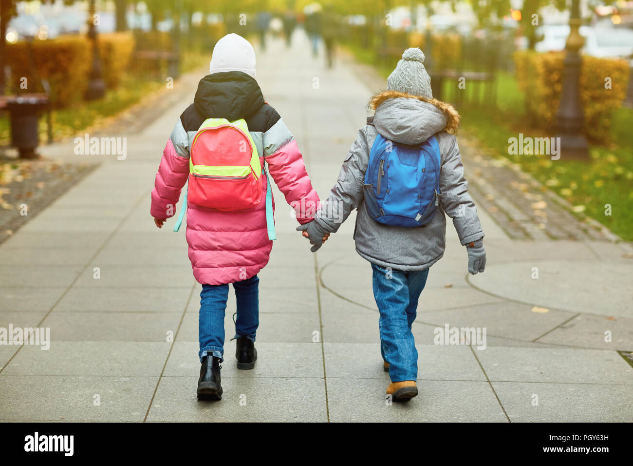 Back view boy walking down hi-res stock photography and images - Alamy