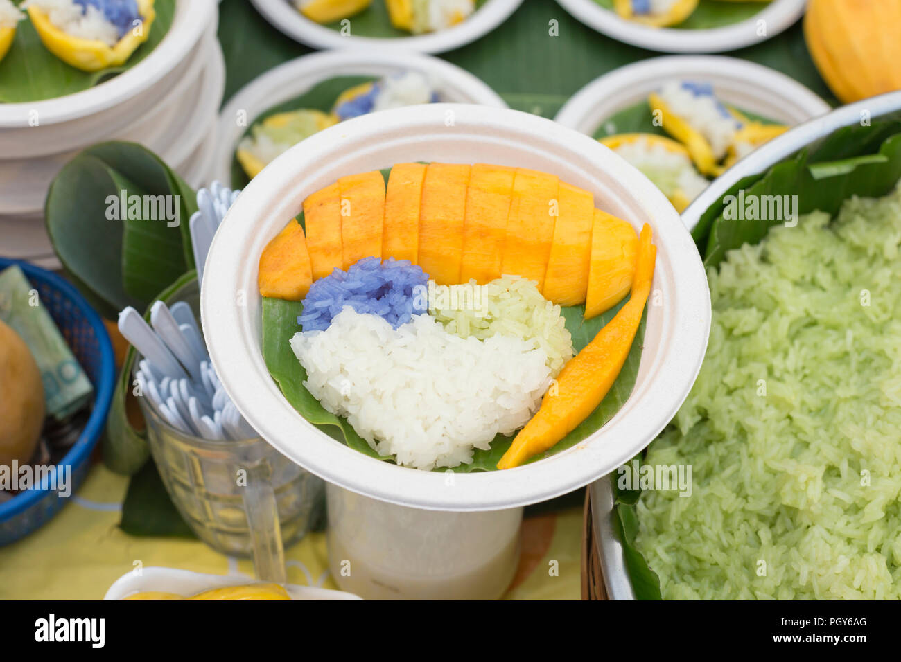 Mango with naturally coloured sticky rice ( butterfly pea and pandan ...