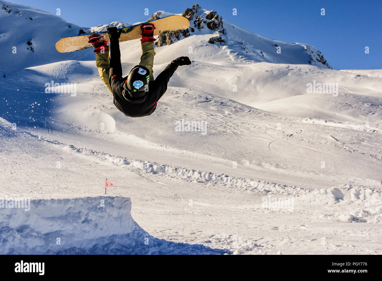 Snowboarder performing trick snow hi-res stock photography and images ...