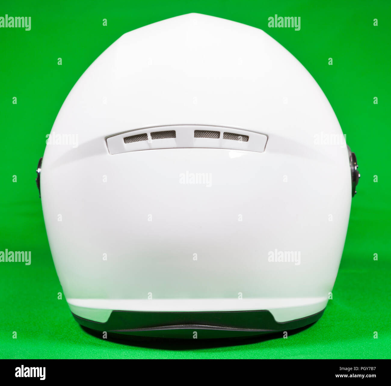 White motorcycle helmet, rear view, green background Stock Photo - Alamy