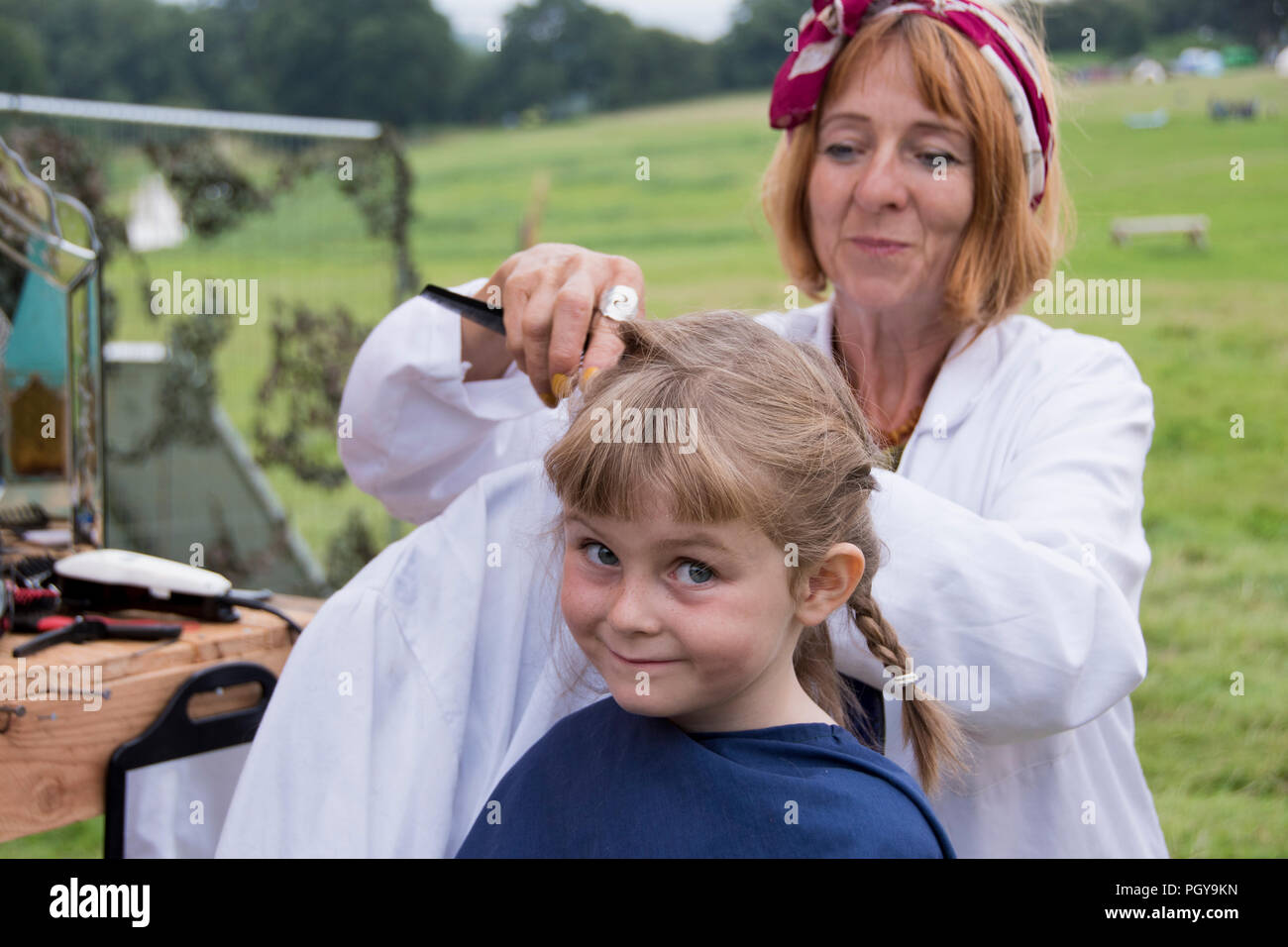 Chepstow, Wales – Aug 14: Young girl enjoys an unexpected hair cut at ...