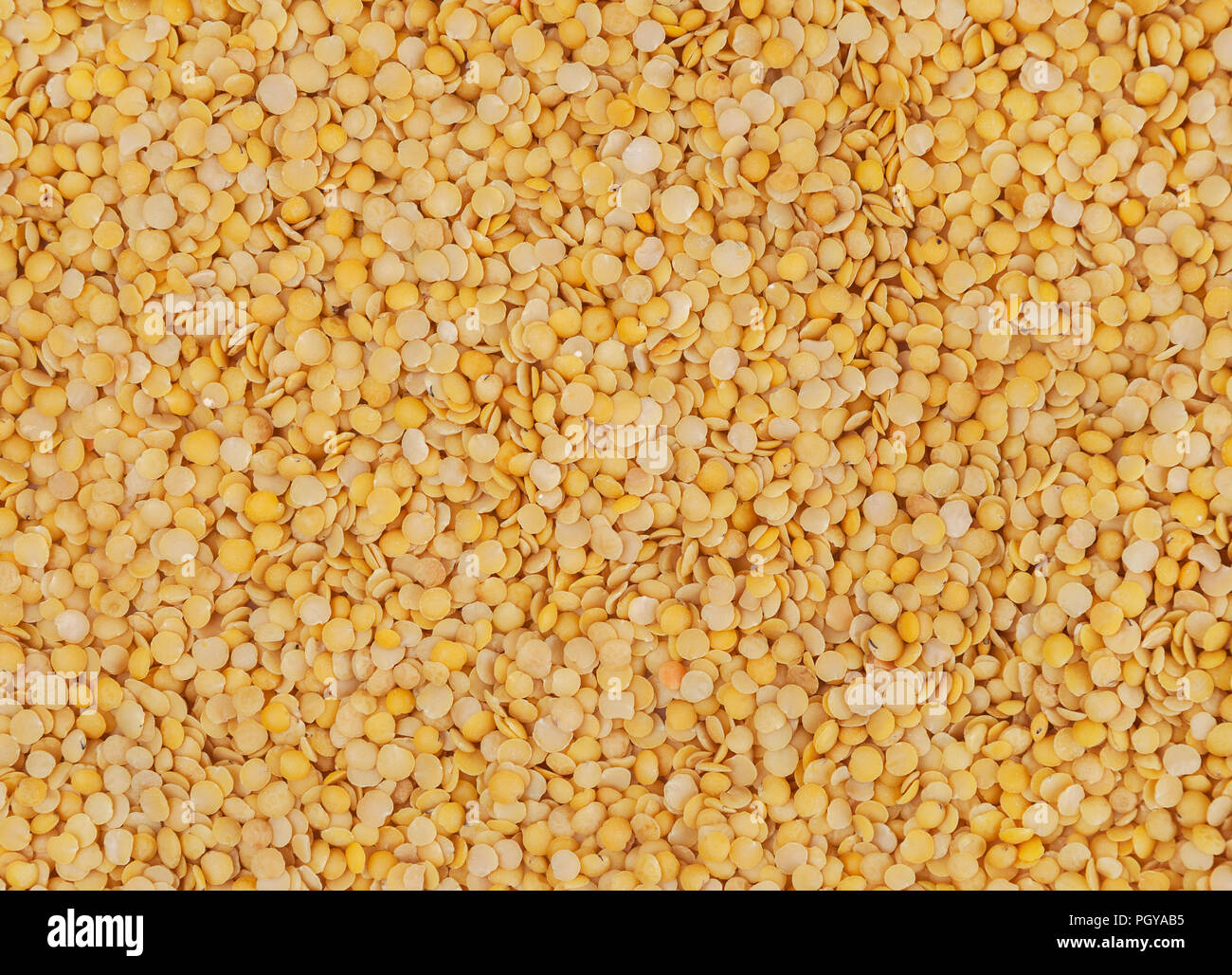 Yellow lentil background Stock Photo - Alamy