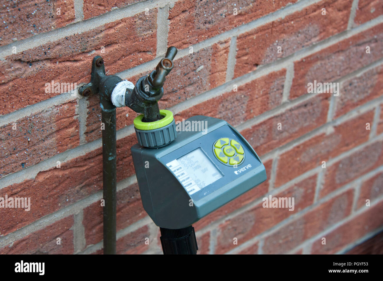 verve programmable water timer fixed to a brick wall Stock Photo - Alamy