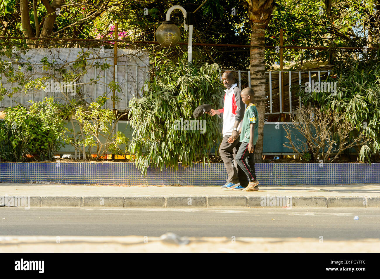 DAKAR, SENEGAL - APR 23, 2017: Unidentified Senegalese man and little ...