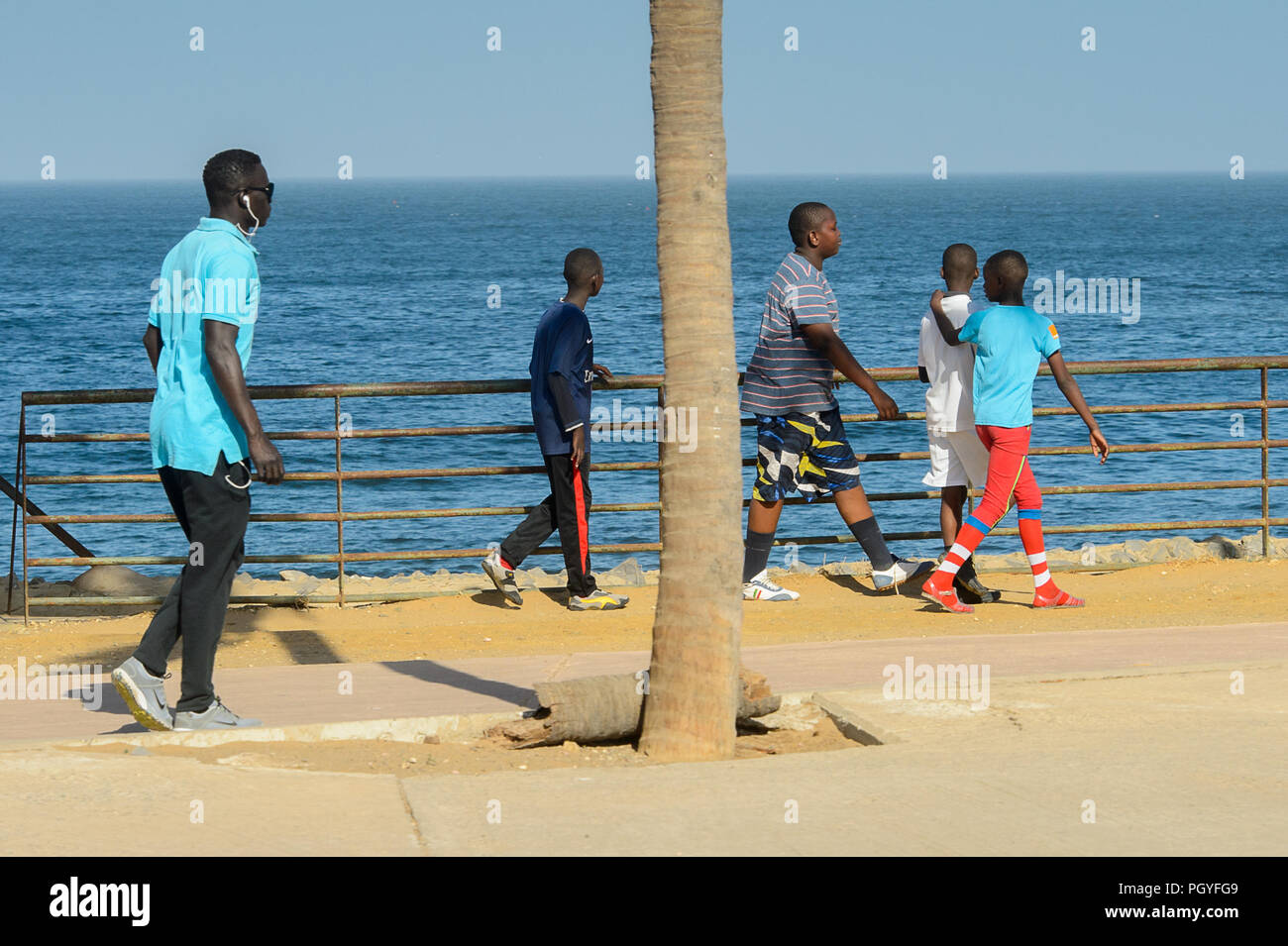 DAKAR, SENEGAL - APR 23, 2017: Unidentified Senegalese boys walk along ...