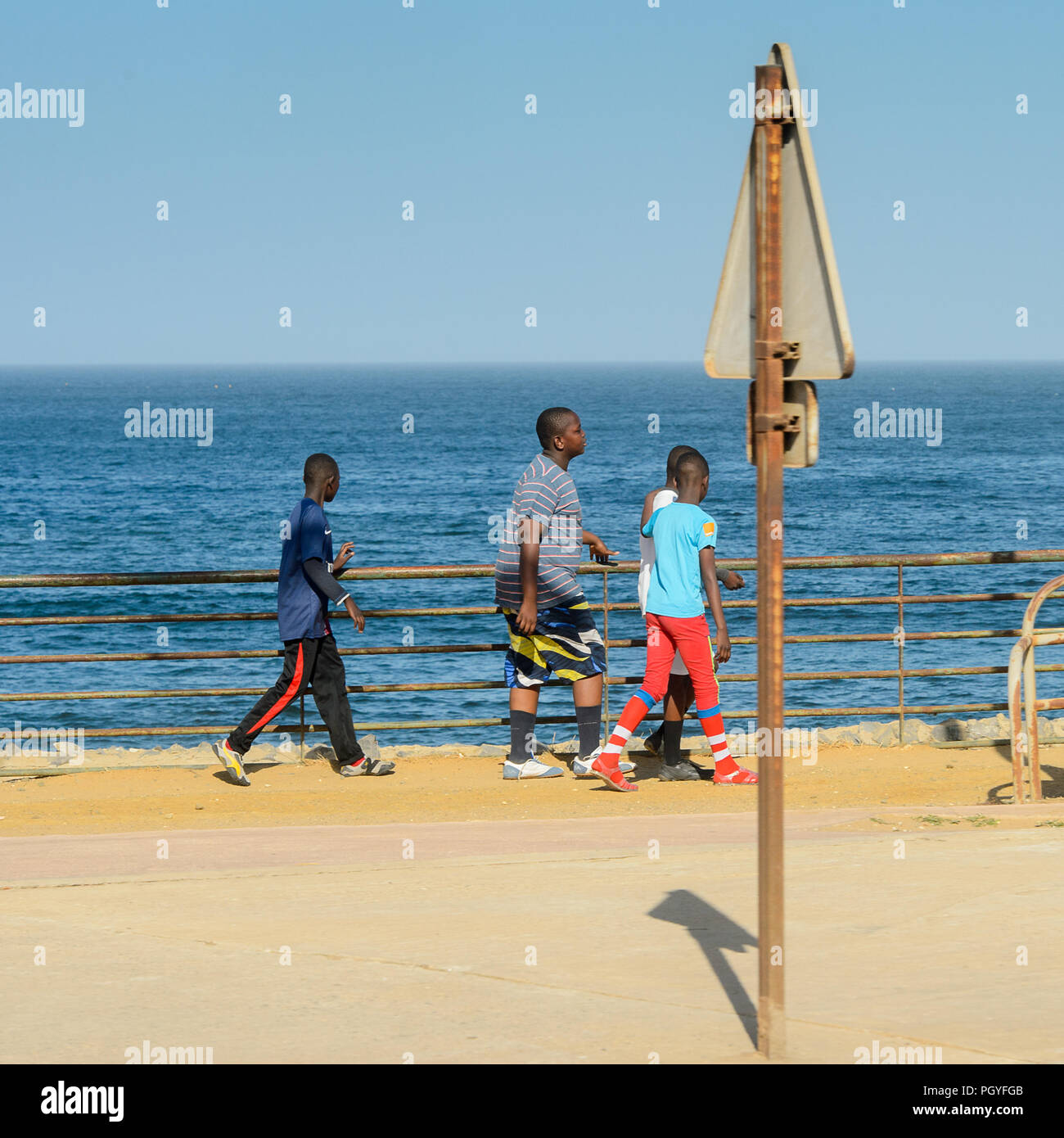 DAKAR, SENEGAL - APR 23, 2017: Unidentified Senegalese boys walk along ...
