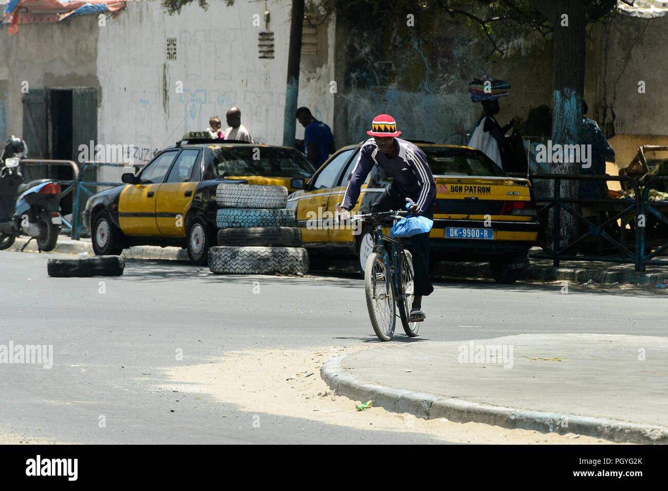 DAKAR, SENEGAL - APR 23, 2017: Unidentified Senegalese man rides a ...