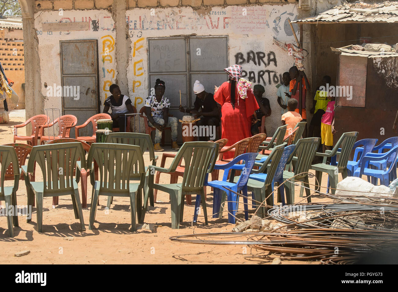 ROAD TO LAMPOUL, SENEGAL - APR 23, 2017: Unidentified Senegalese people ...