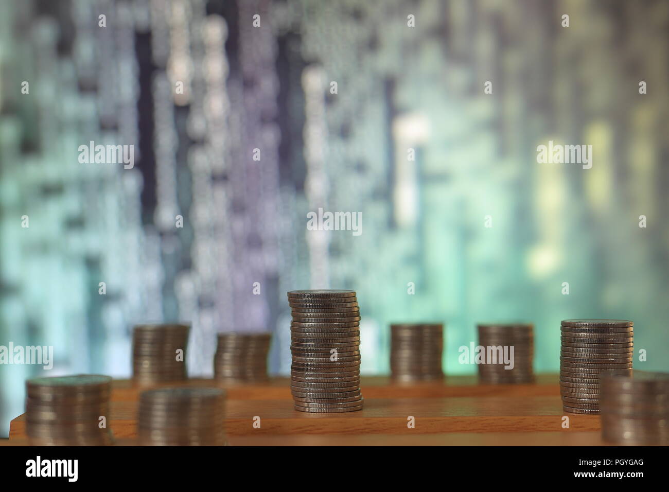 secured internet business. big coin piles in front of blue binary code ...