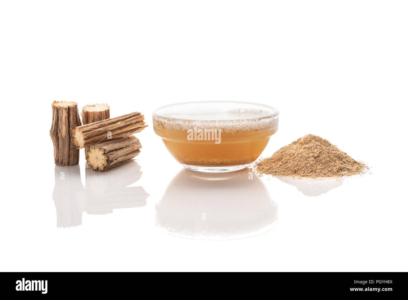 African dream roots, extract and powder in glass bowl isolated on white ...