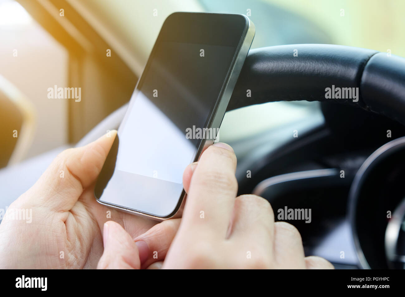 using mobile smart phone while driving the car Stock Photo - Alamy