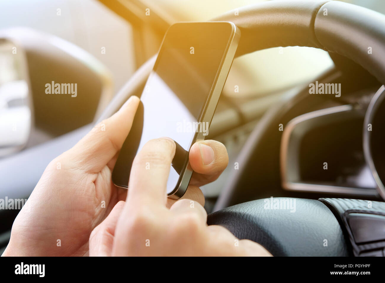 using mobile smart phone while driving the car Stock Photo - Alamy