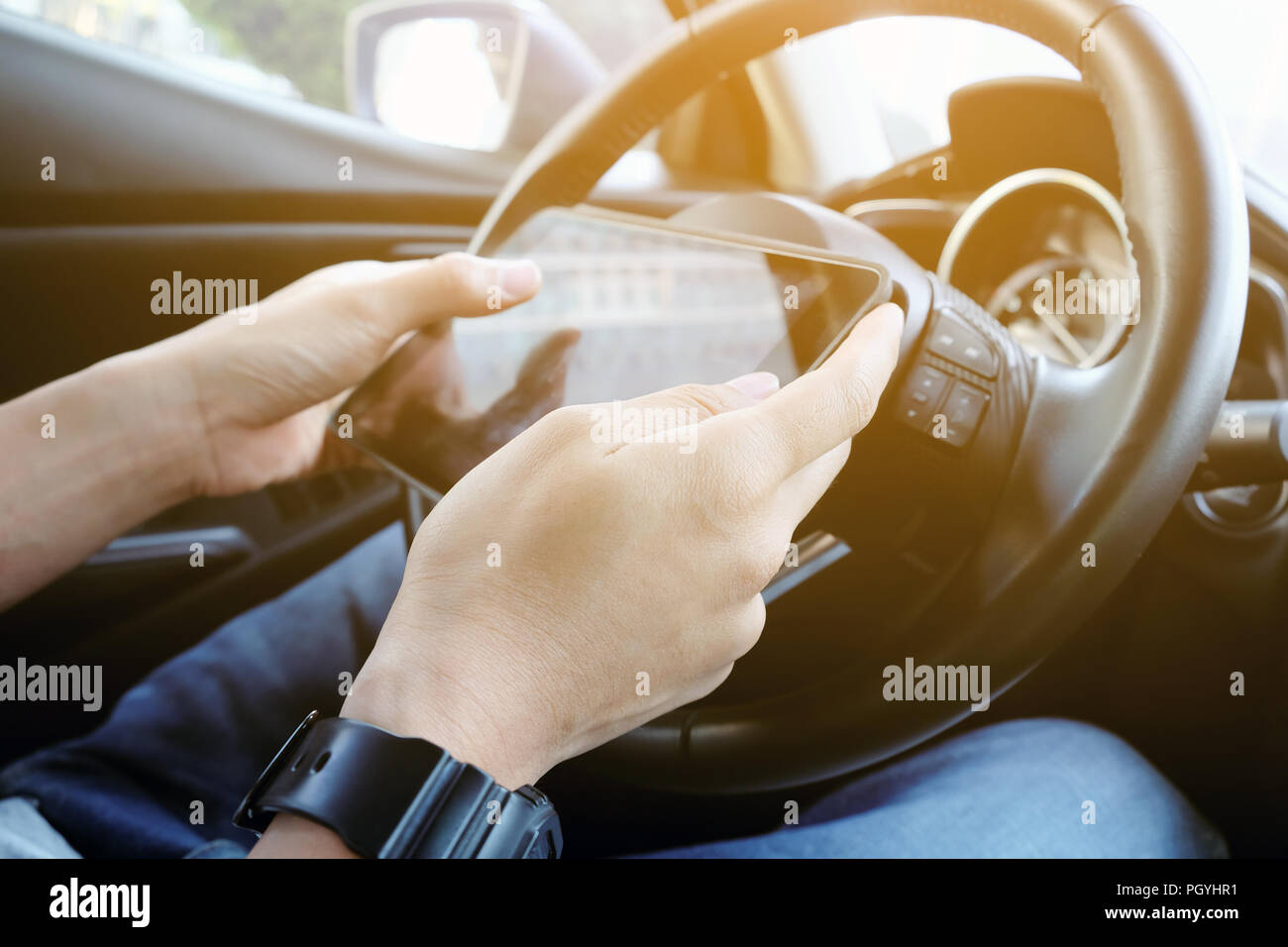 using digital tablet while driving the car Stock Photo - Alamy