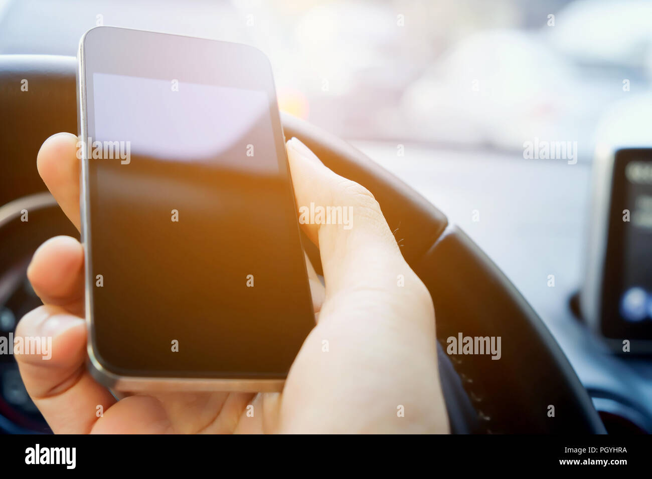 using mobile smart phone while driving the car Stock Photo - Alamy