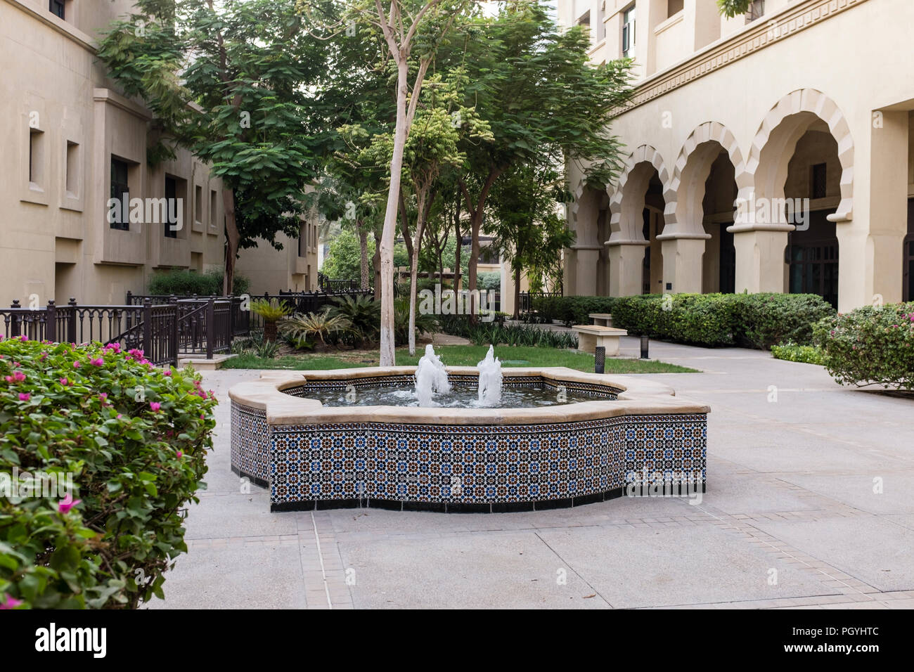 Courtyard with a tiled fountain in a heritage-style residential ...