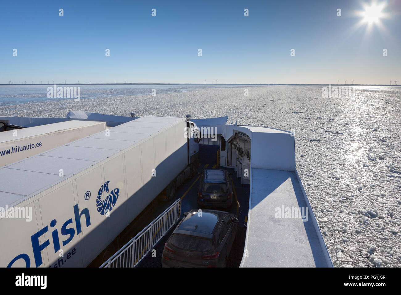 ESTONIA- CIRCA MAR, 2018: Ferryboat floats through the ice in strait ...