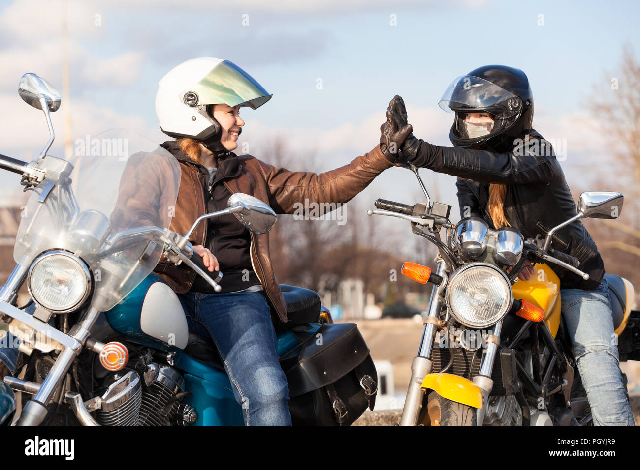 Clapping hands in leather gloves while greeting each other on urban ...