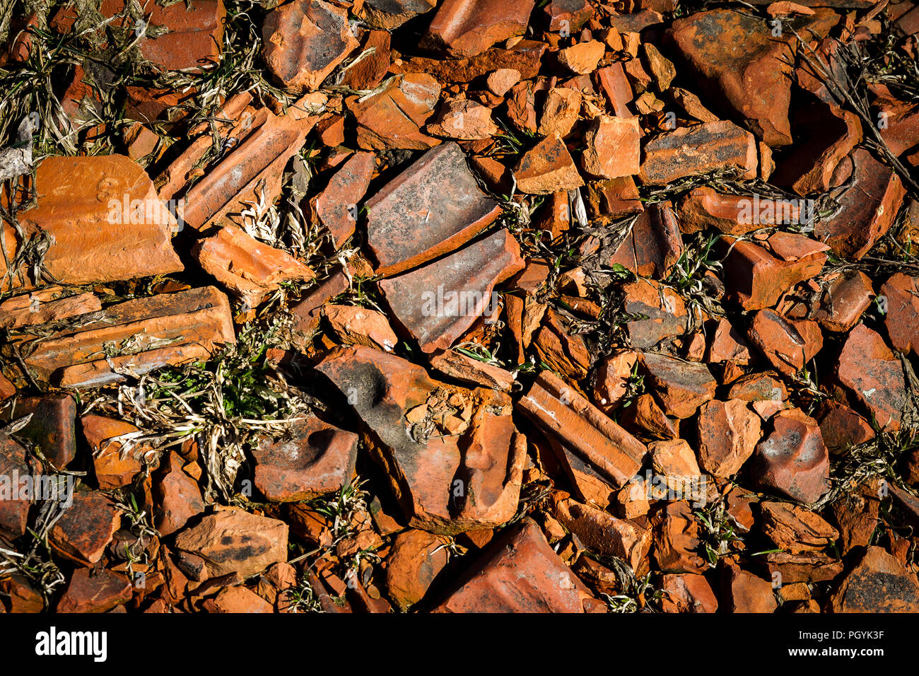 Old broken ceramic roof tiles on a ground. Shattered roof tiles Stock ...