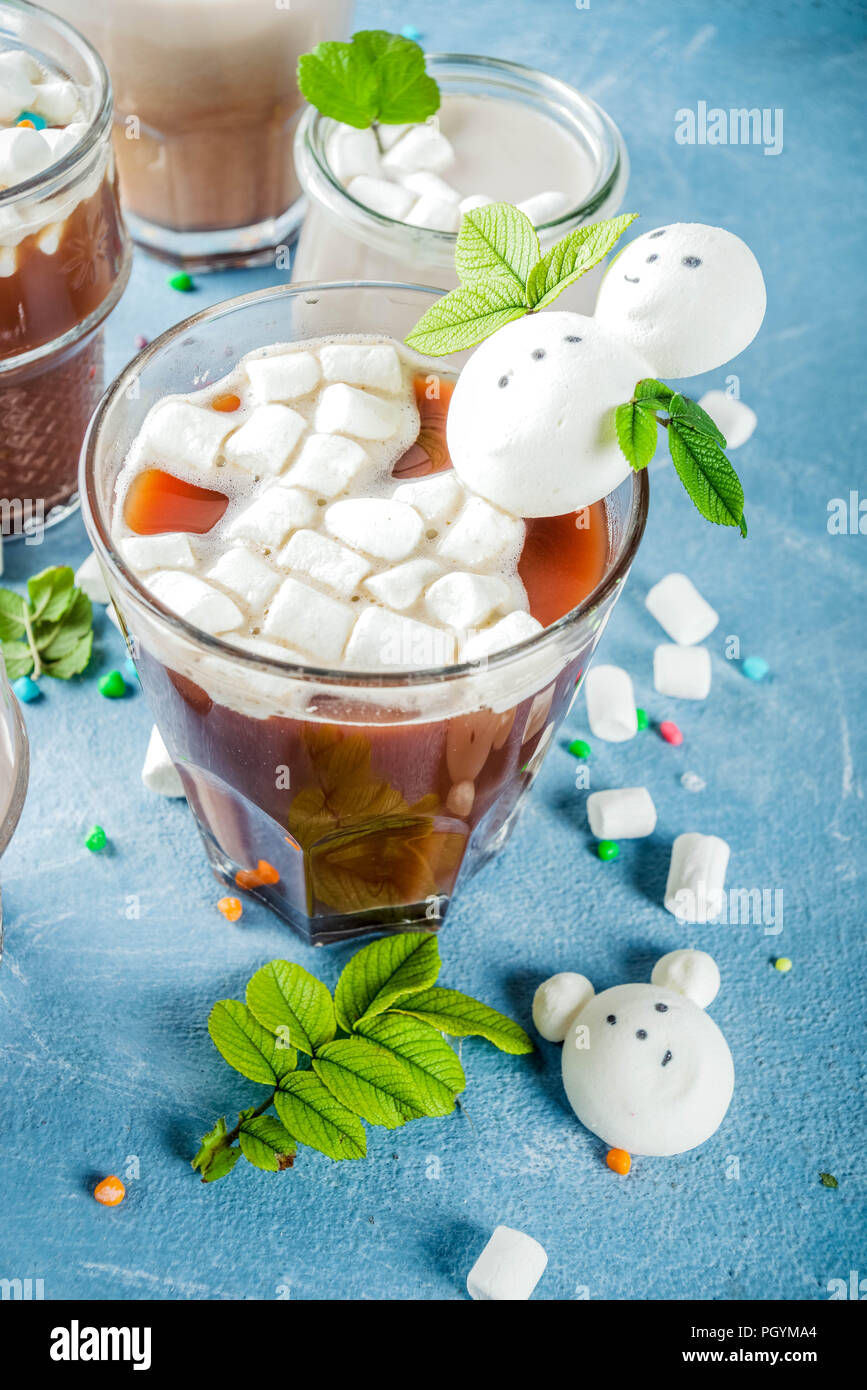 Variations of bitter and dairy hot chocolate with funny marshmallow in ...