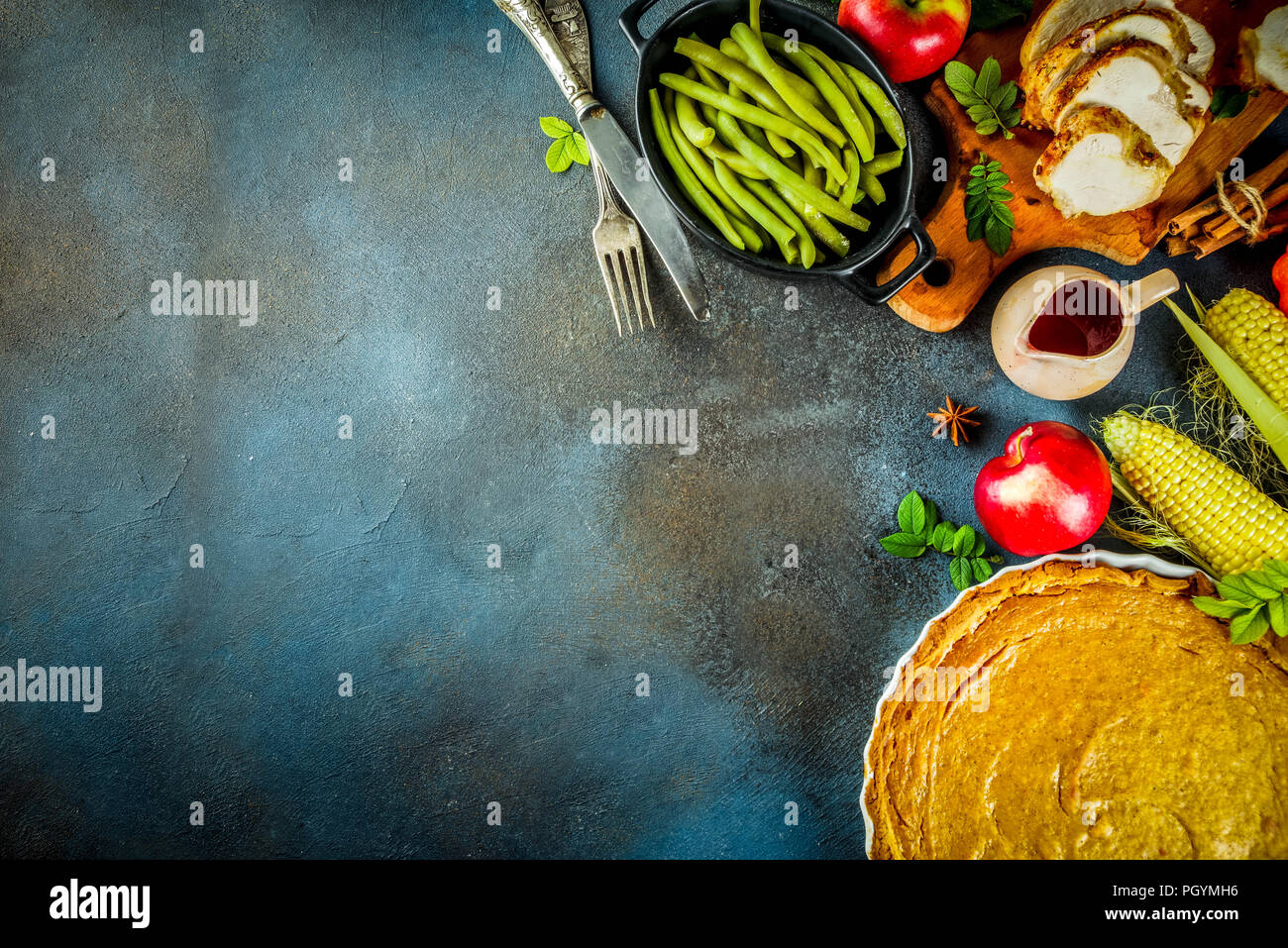 Thanksgiving holiday table with traditional festive food - turkey ...