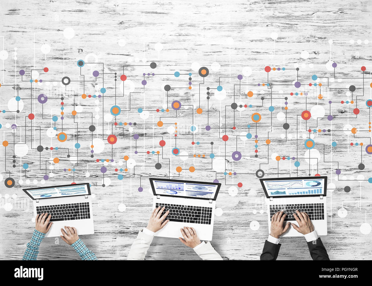 Group of three people with devices in hands working together as symbol ...